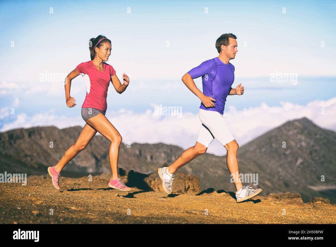 Running people - Runners training outdoor. Young sports athletes couple ...
