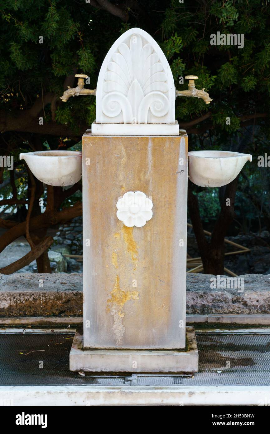 Outdoor fresh tap water faucet and stone pool on the street Stock Photo ...