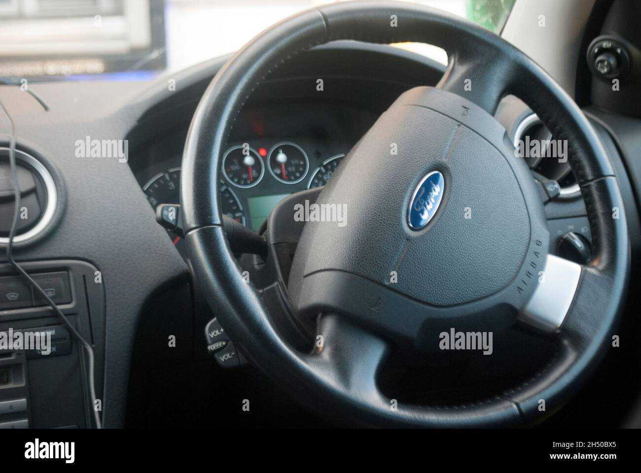 Steering wheel and dashboard of Ford Focus car Stock Photo - Alamy