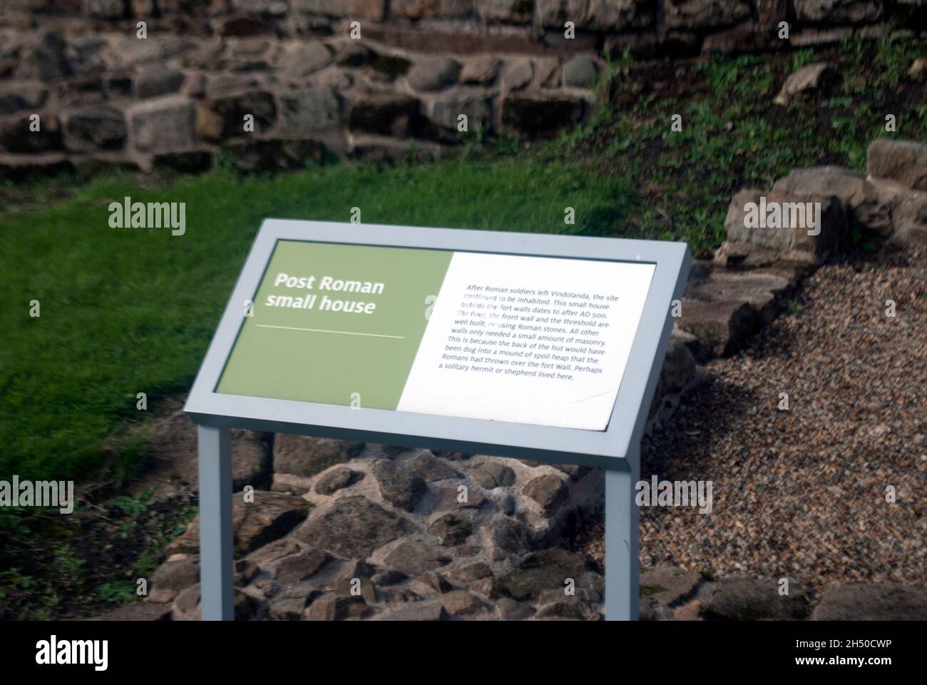 Post Roman Small House sign with wall in the background at Vindolanda ...