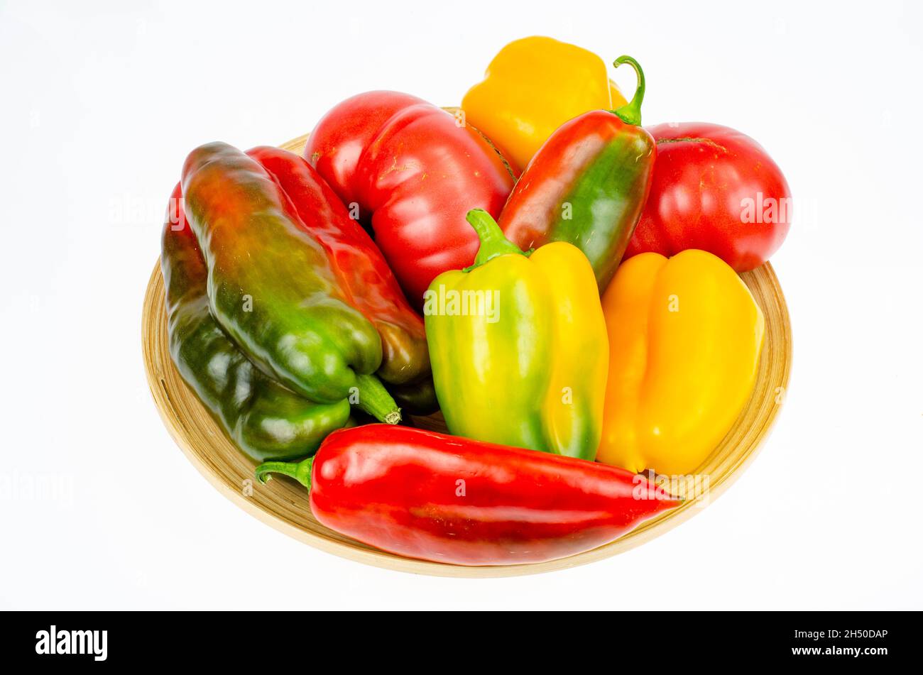 Arrangement of colorful fresh assorted bell peppers and tomatoes in ...