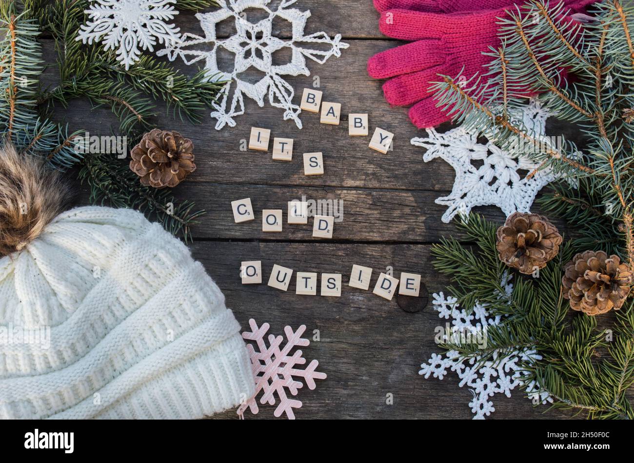 crochet snowflake ornaments on wooden ground with winter slogans and ...