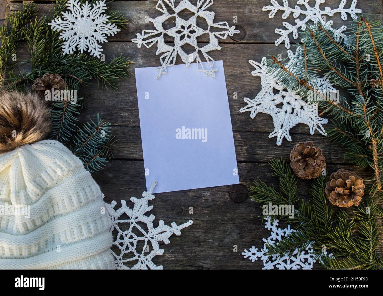 crochet snowflake ornaments on wooden ground with space for text and ...