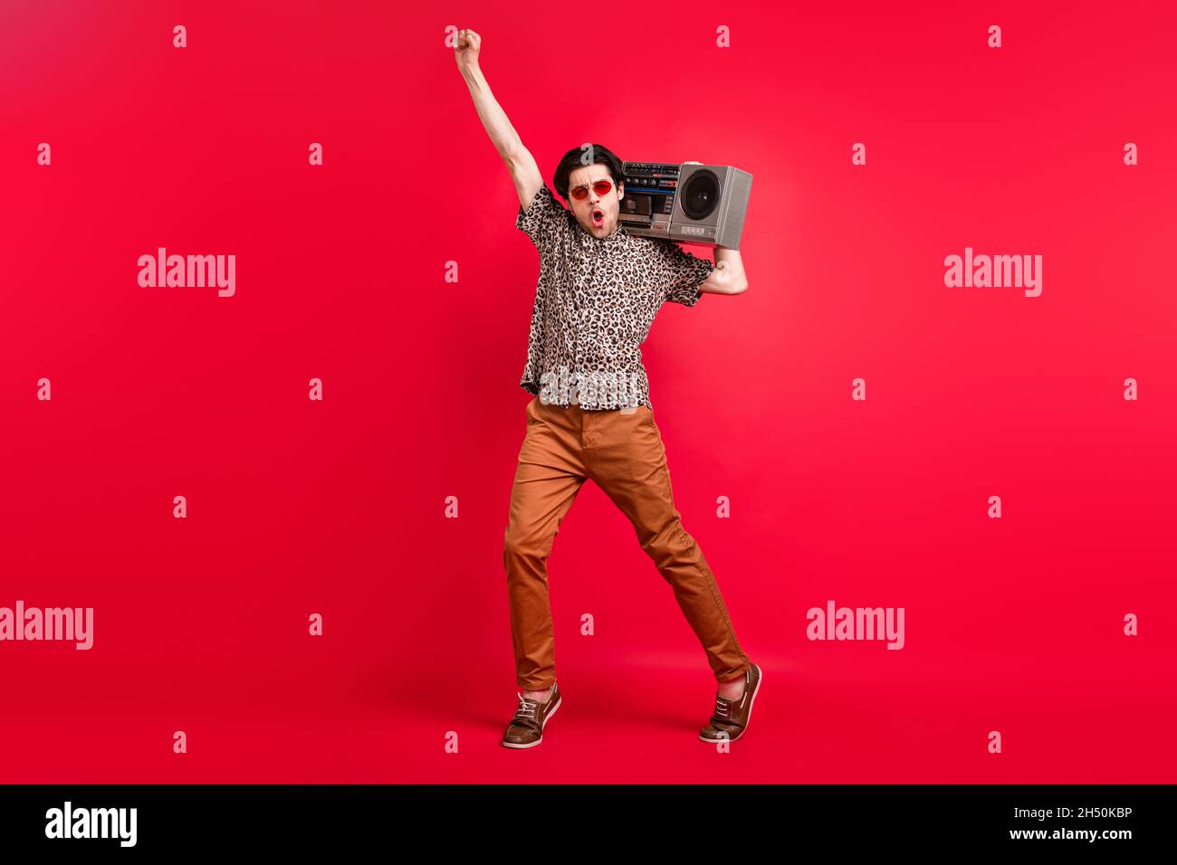 Full size photo of excited good mood guy listen music boombox dancing ...