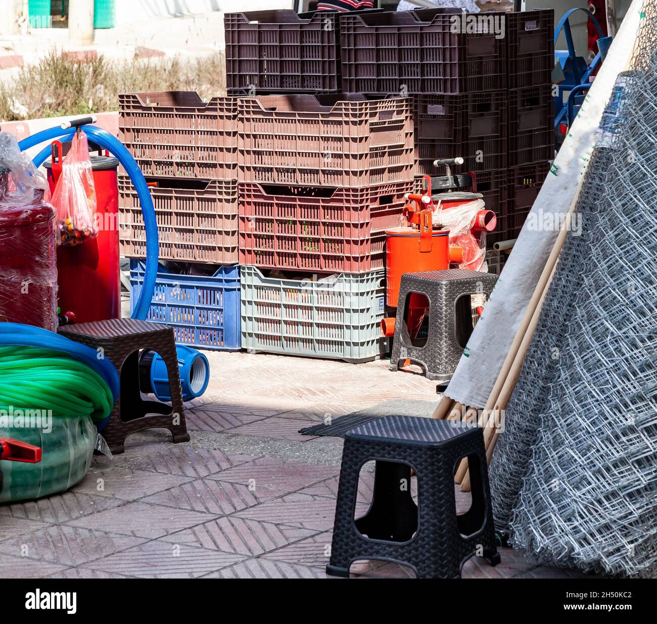 Colored plastic boxes for fruit stacked in piles for sale Stock Photo ...