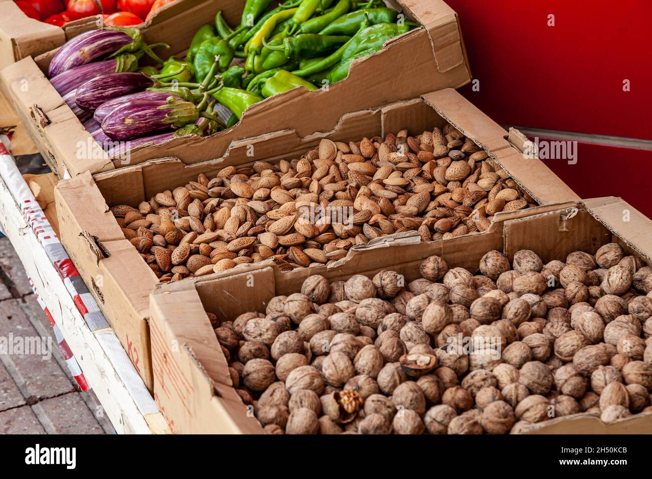 Selling nuts. Assortment of different salted and sweet organic nuts ...