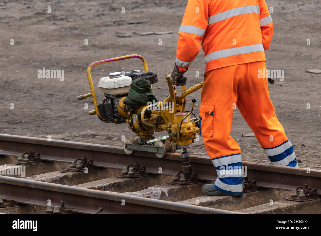A screwing machine is used to tighten or unscrew small iron in track ...