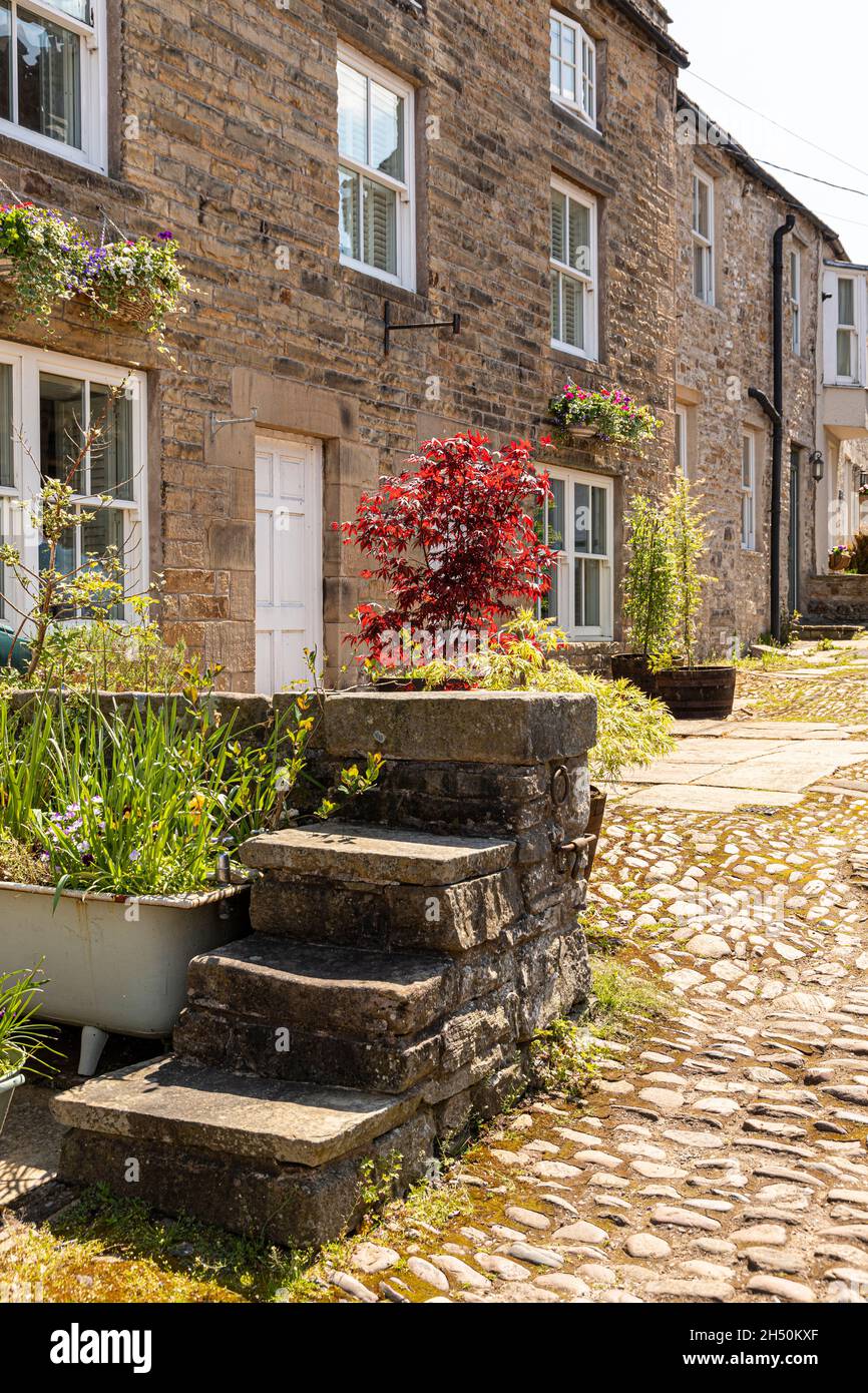 An old stone mounting block in the upland Pennines town of Alston ...