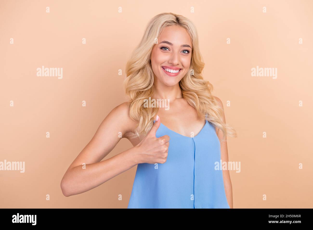 Photo of adorable sweet young lady wear blue singlet smiling showing ...