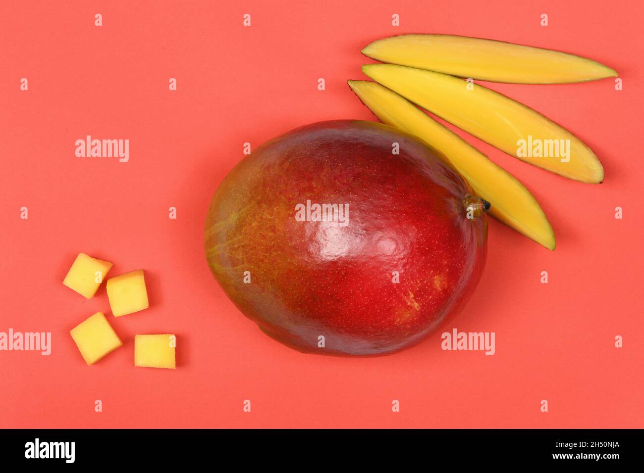 Fresh Mango fruits isolated on red background. High resolution photo ...