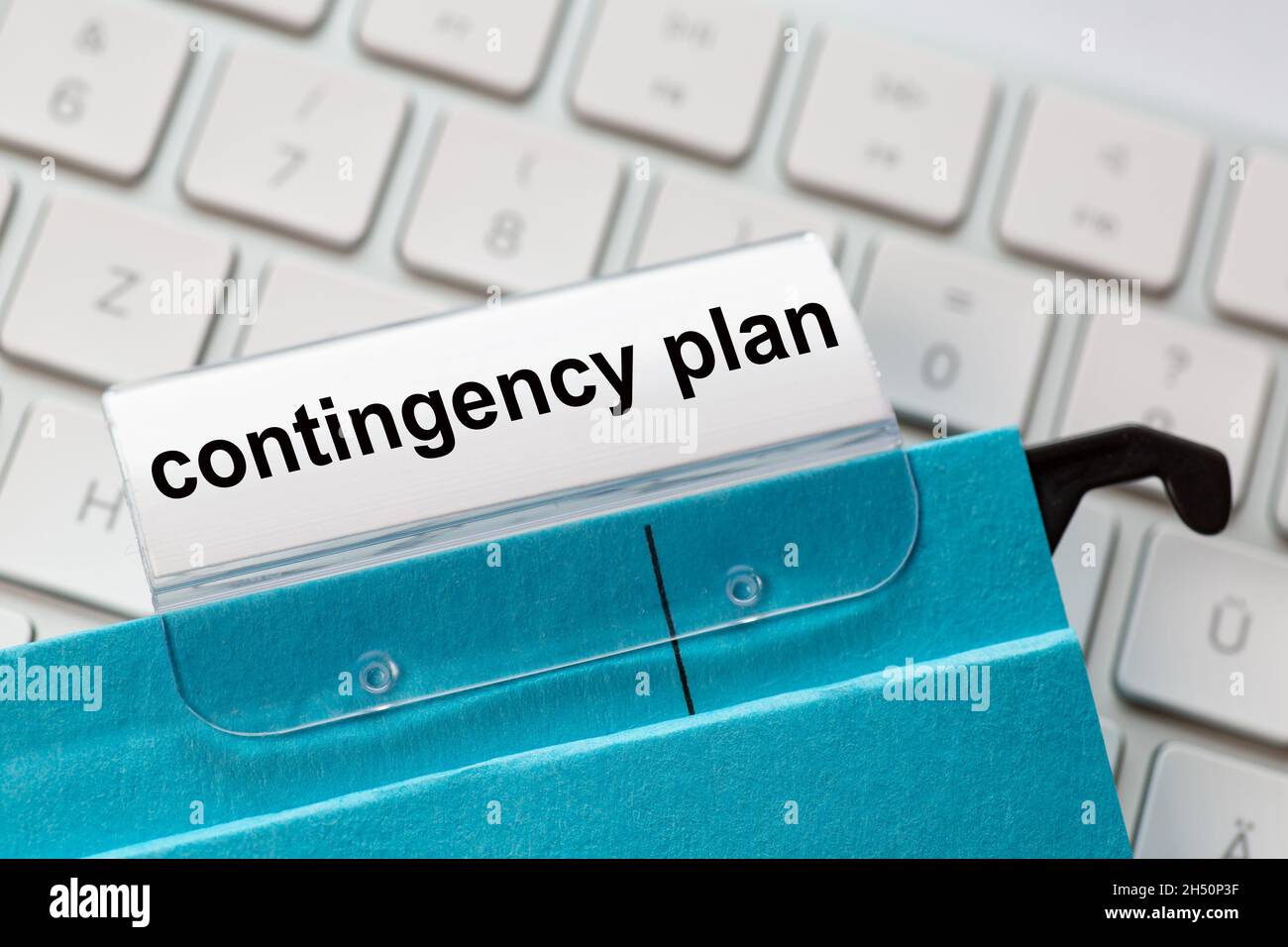 contingency plan is on a label of a blue hanging file. In the ...