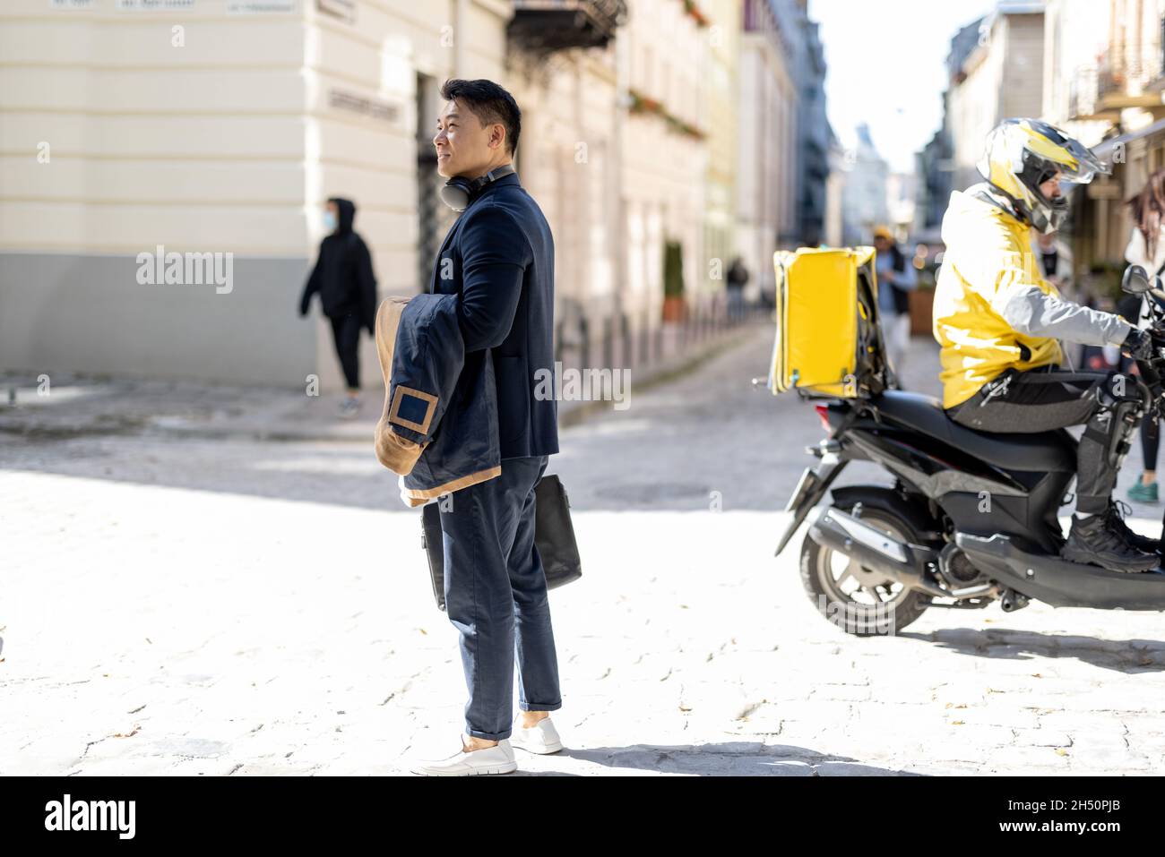 Man stand on city street and wait for someone Stock Photo - Alamy