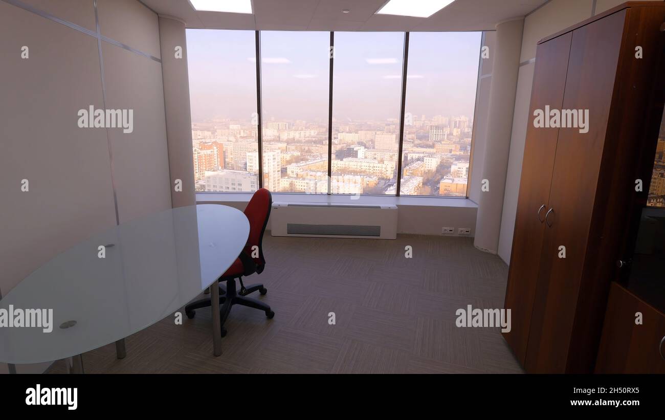View of room from panoramic window on city landscape. Small cozy room ...