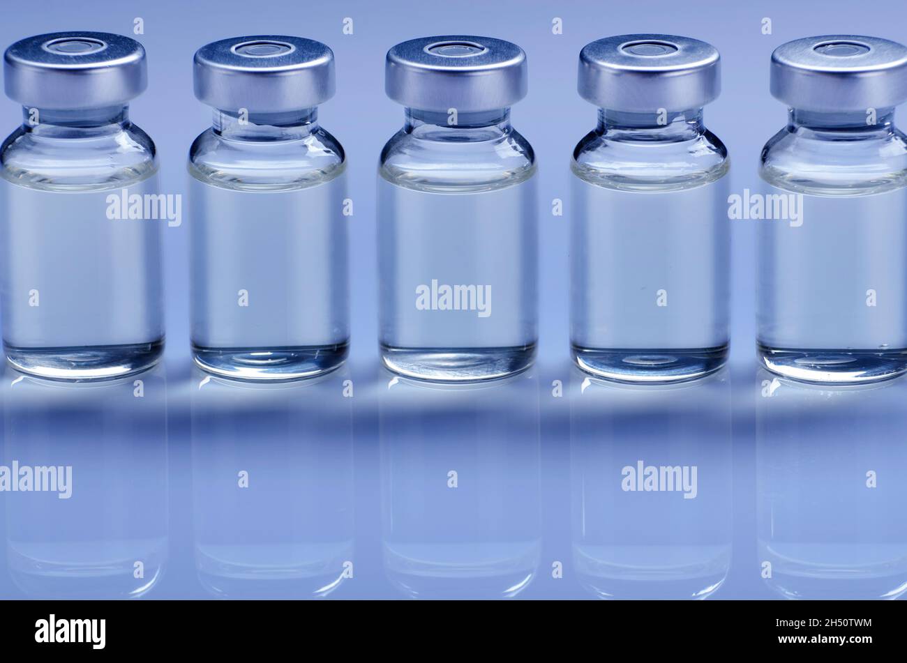 Vials with liquid drug as vaccine dose flu shot for injection treatment ...