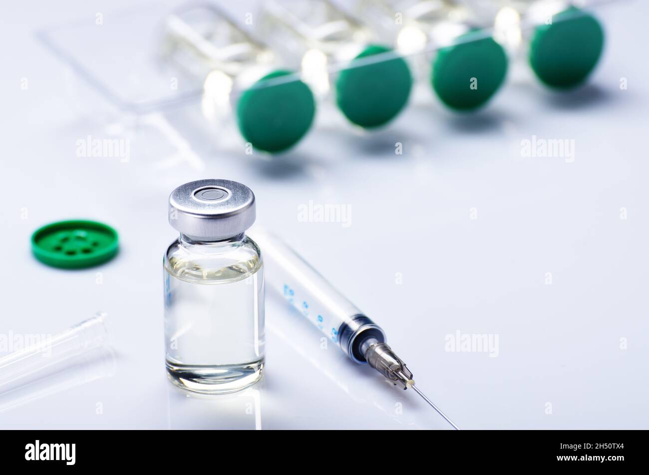 Just opened vial with liquid drug as vaccine ready dose flu shot along ...