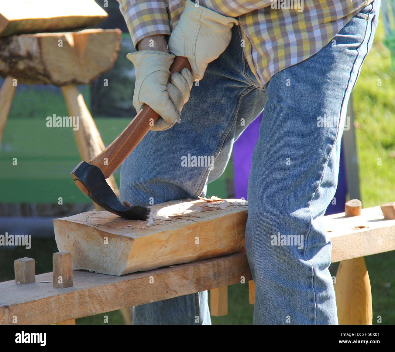 A Traditional Craftsman Shaping a Block of Wood Stock Photo - Alamy
