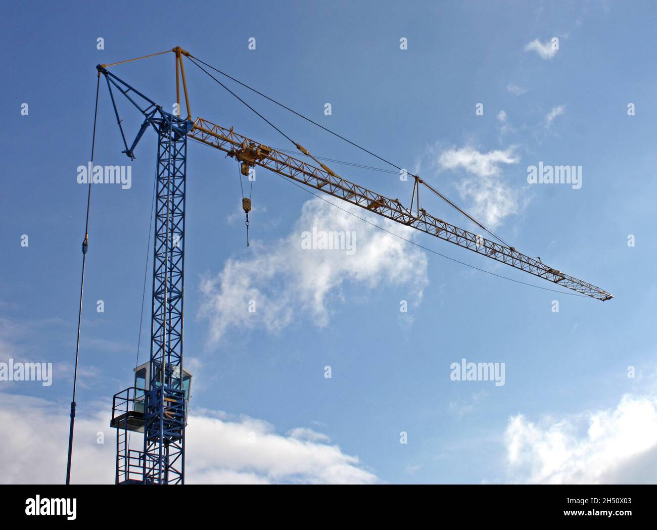 A Tall Tower Crane on a Building Construction Site Stock Photo - Alamy