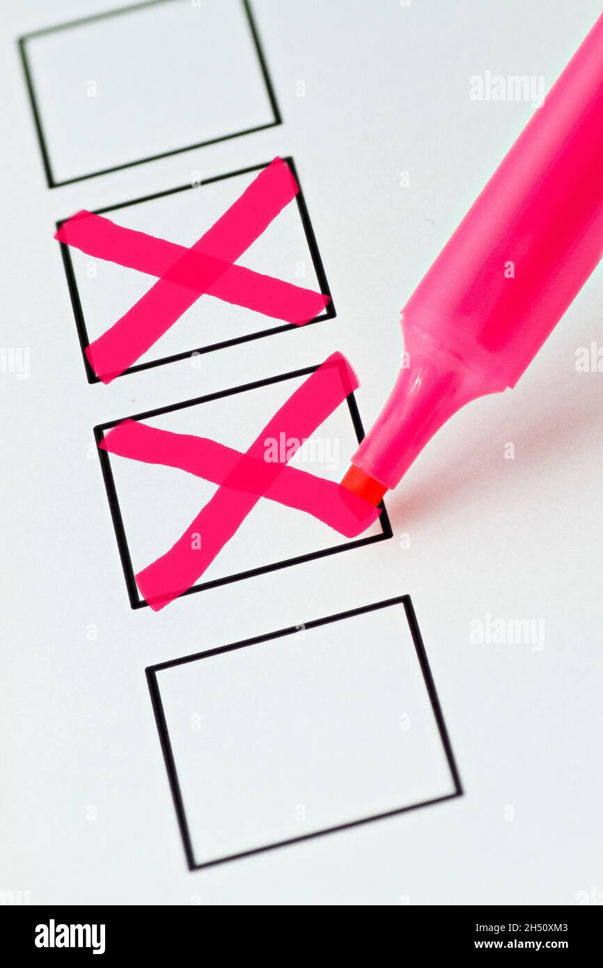 A base on which rectangular checkboxes are printed. A pink marker has ...