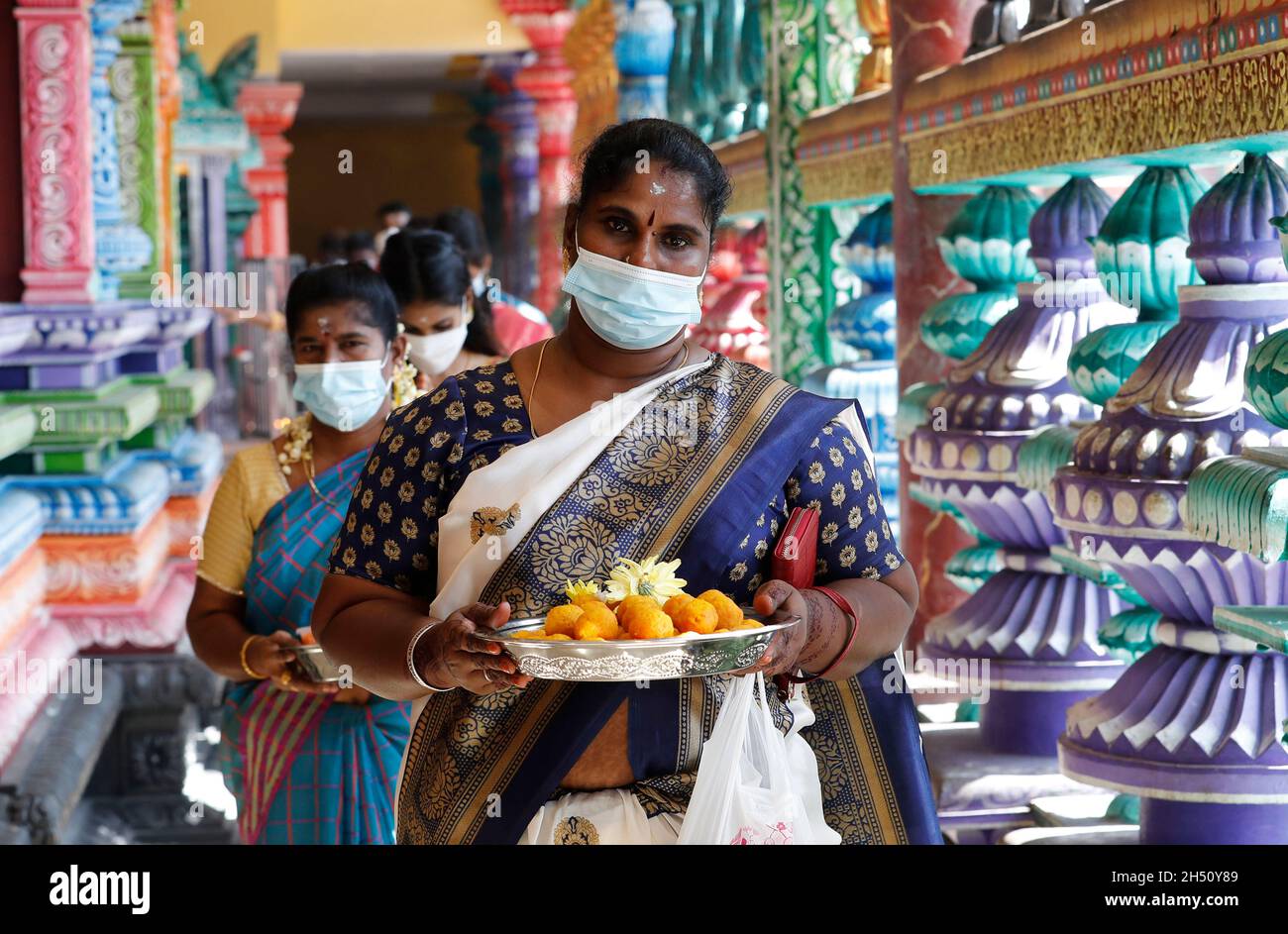 Hindu devotees seen offering prayers at the Batu Caves temple during ...