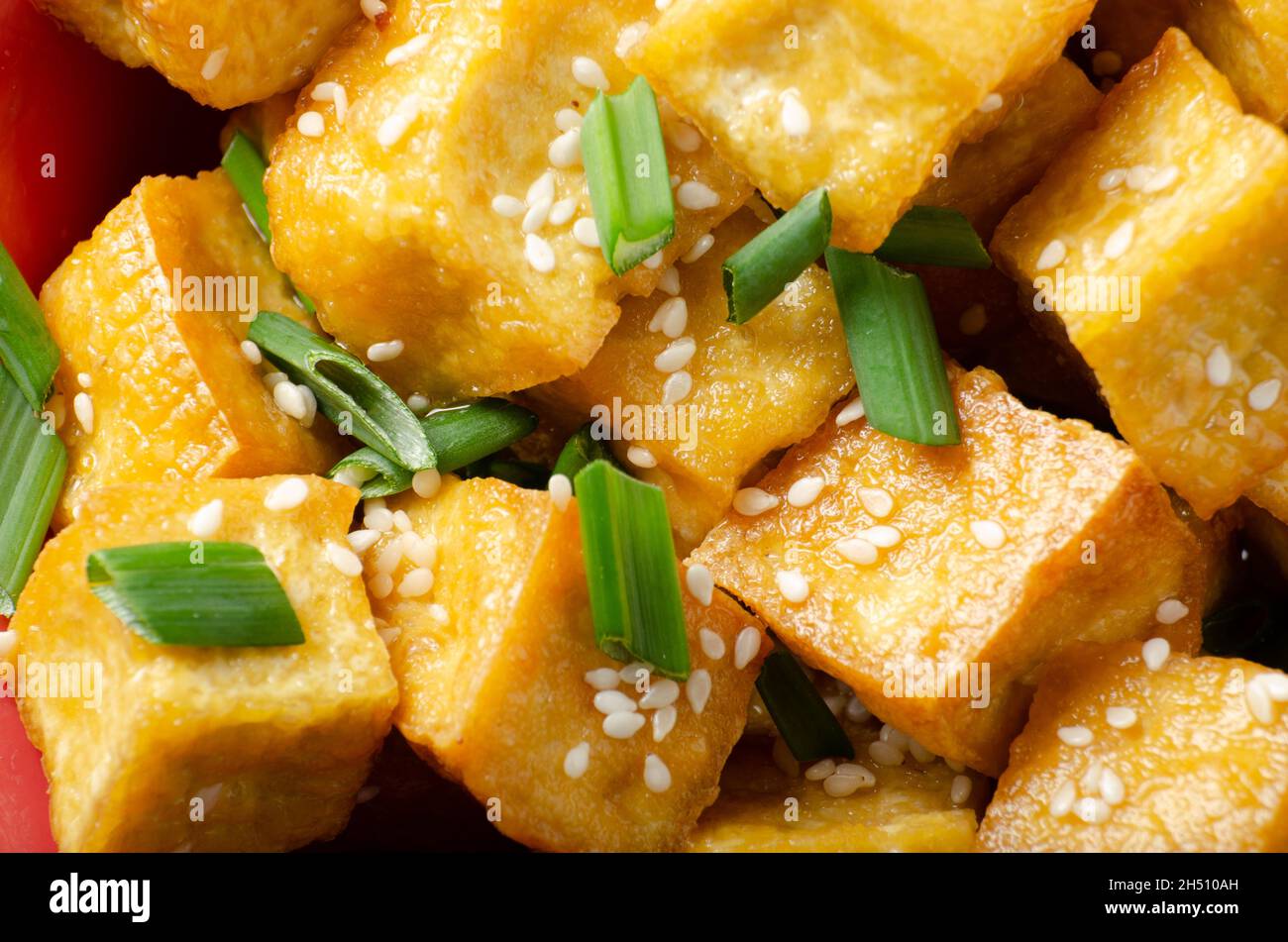 Flat lay background of Close Up view at crispy fried tofu pieces with ...