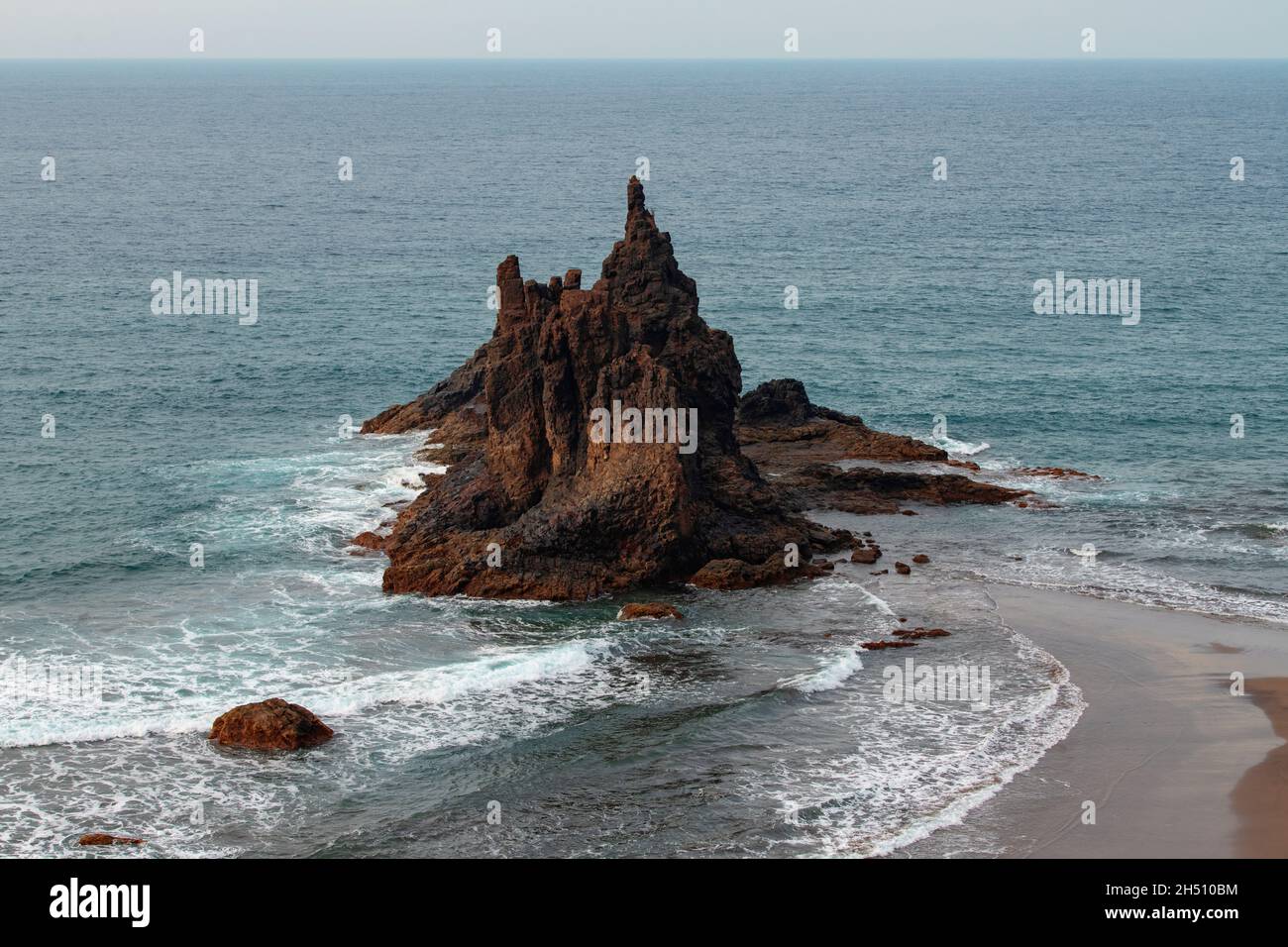 Majestic volcanic rocks emerging from Atlantic Ocean, surrounded by ...