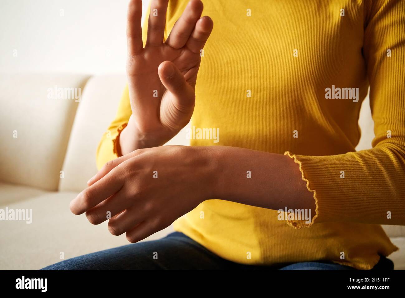 Young teenage girl top practicing EFT tapping or emotional freedom ...