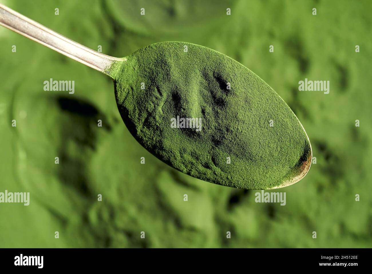 Chlorella algae powder on a metal spoon - healthy nutritional ...
