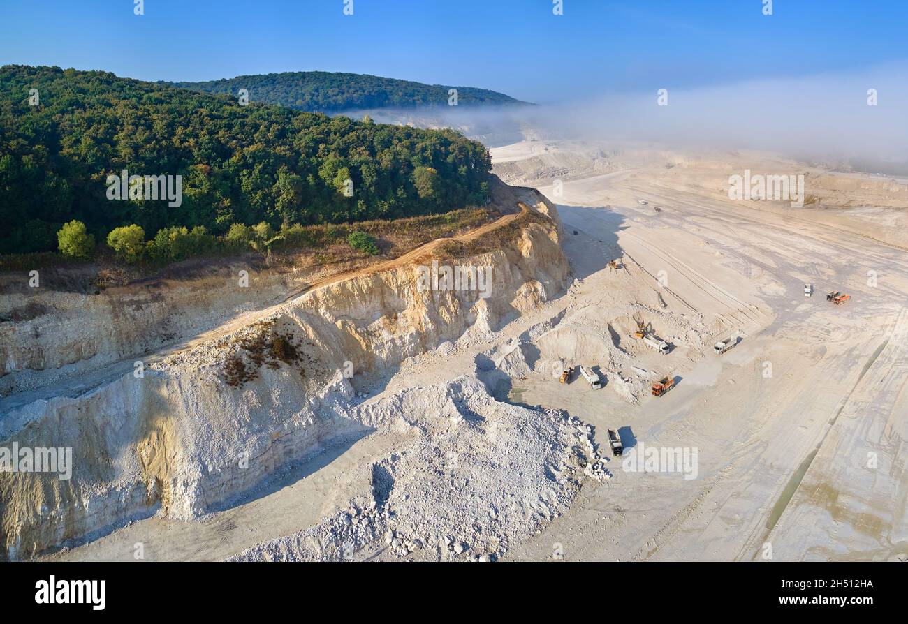 Aerial view of open pit mining of limestone materials for construction ...