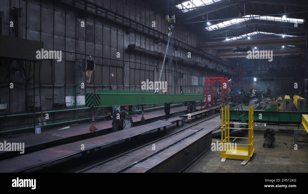 I-beam bridge crane. Clip. Warehouse with large yellow metal beams ...