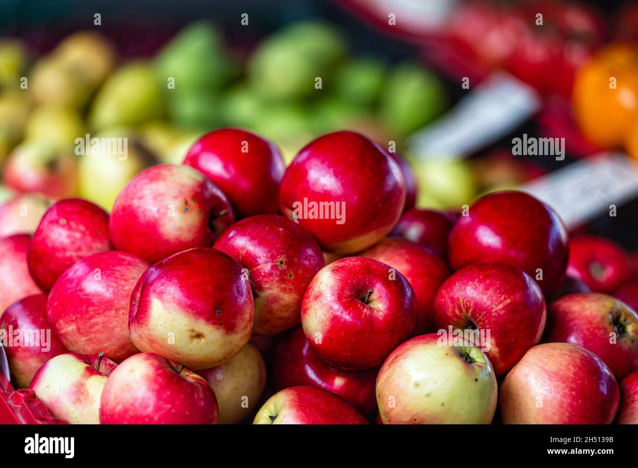 fresh red apples on a market, apples at the farmers market, closeup ...