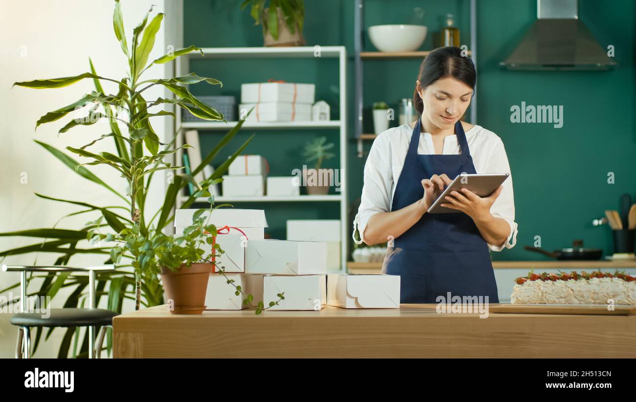 Successful Female Small Business Owner Prepares a Customer Order ...