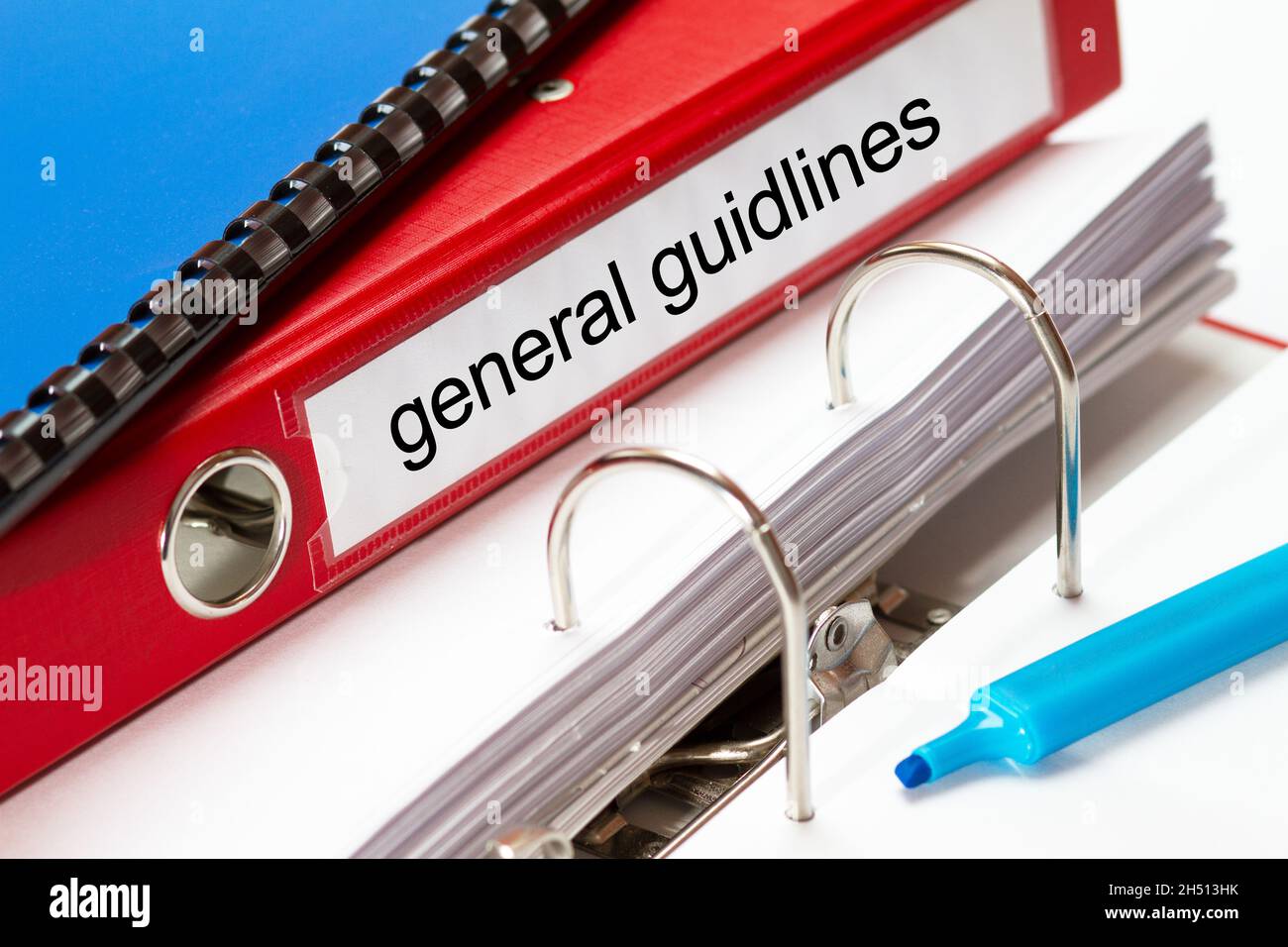 large red folder for general guidelines including blue ring binder and ...