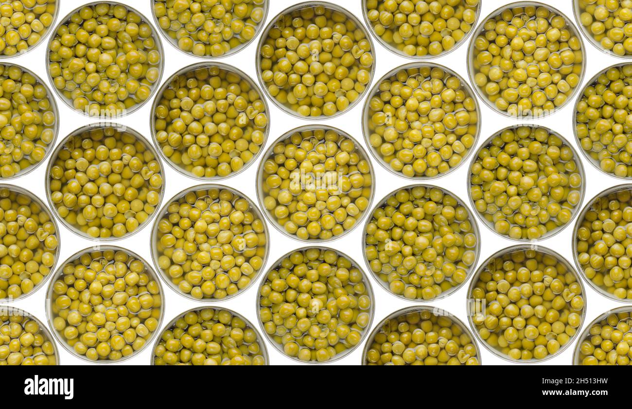 Seamless background of flat lay opened tin cans with green peas ...