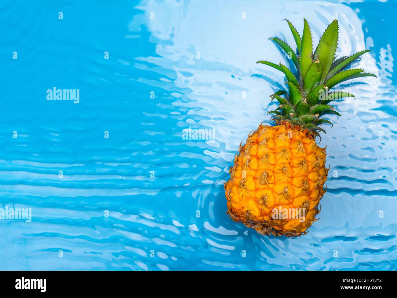 Fresh pineapple in water. Fresh Ripe Pineapples Floating In Pure Water ...