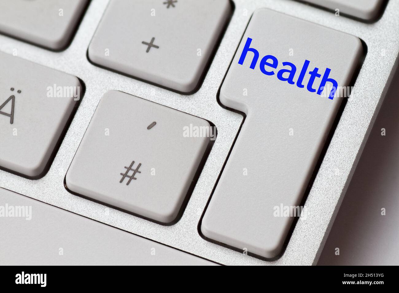 Doctor studies information on computer hi-res stock photography and ...