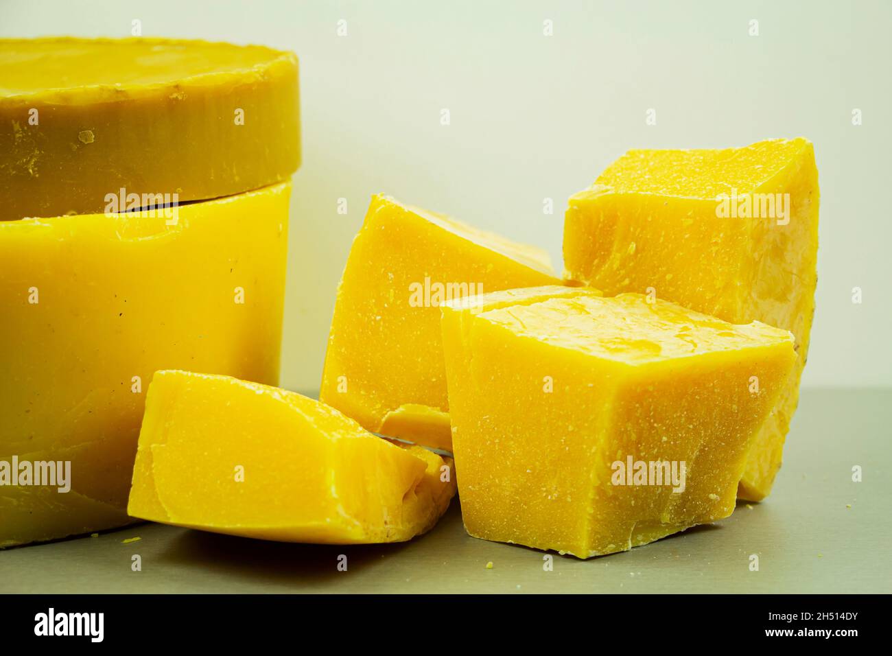 large pieces of natural beeswax, close-up, raw materials for candles ...