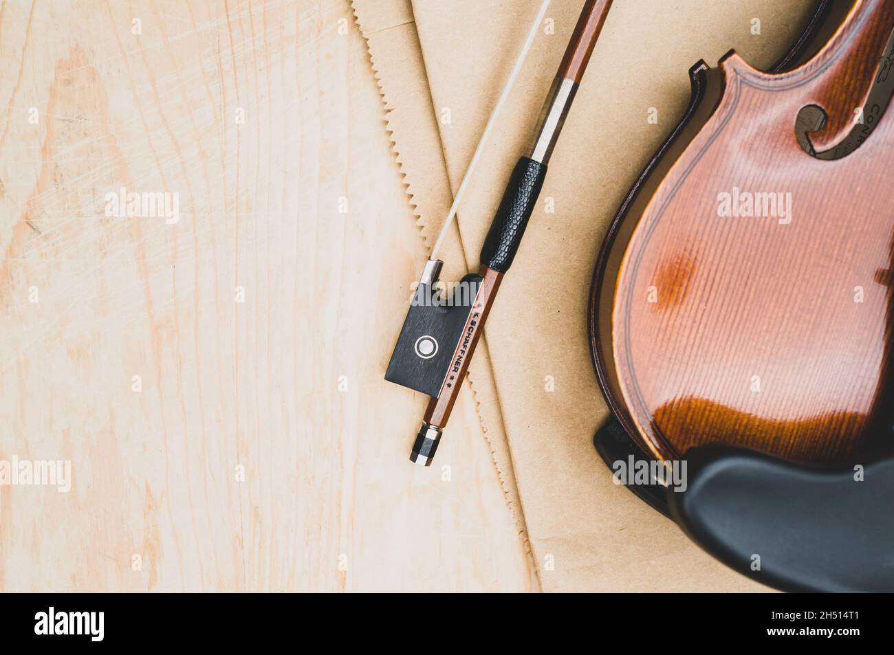 COMO, ITALY - Nov 04, 2021: top view of elegant acoustic violin and bow ...