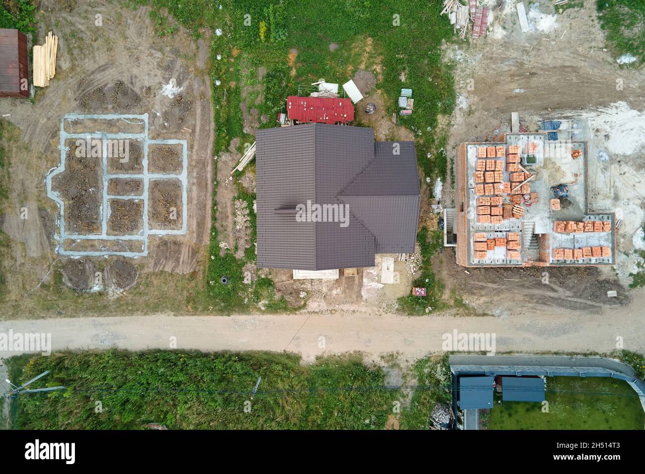 Top down aerial view of building works of new house concrete foundation ...