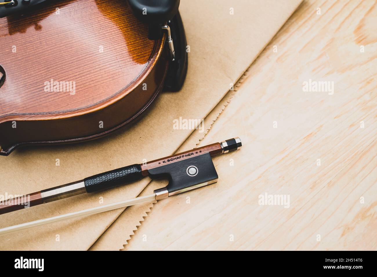 COMO, ITALY - Nov 04, 2021: top view of elegant acoustic violin and bow ...