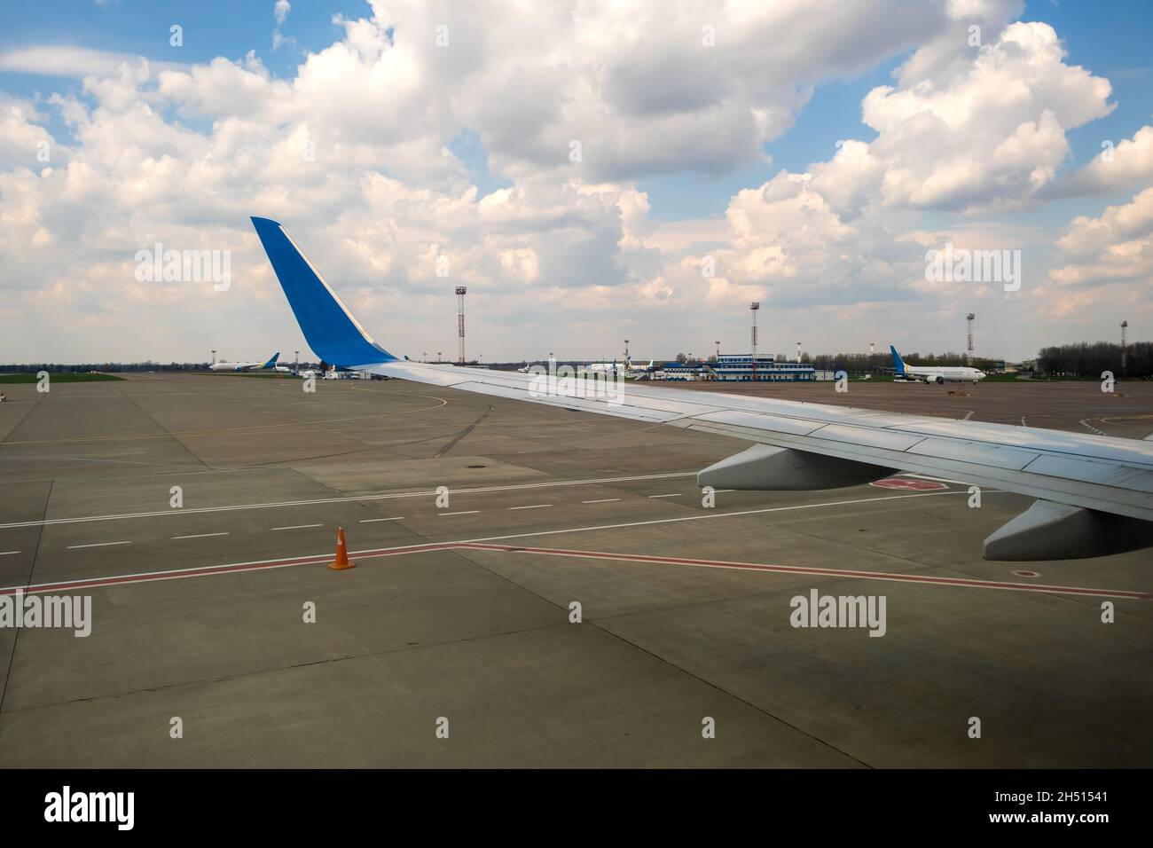 View of jet airplane wing taxiing runway after landing at airport ...