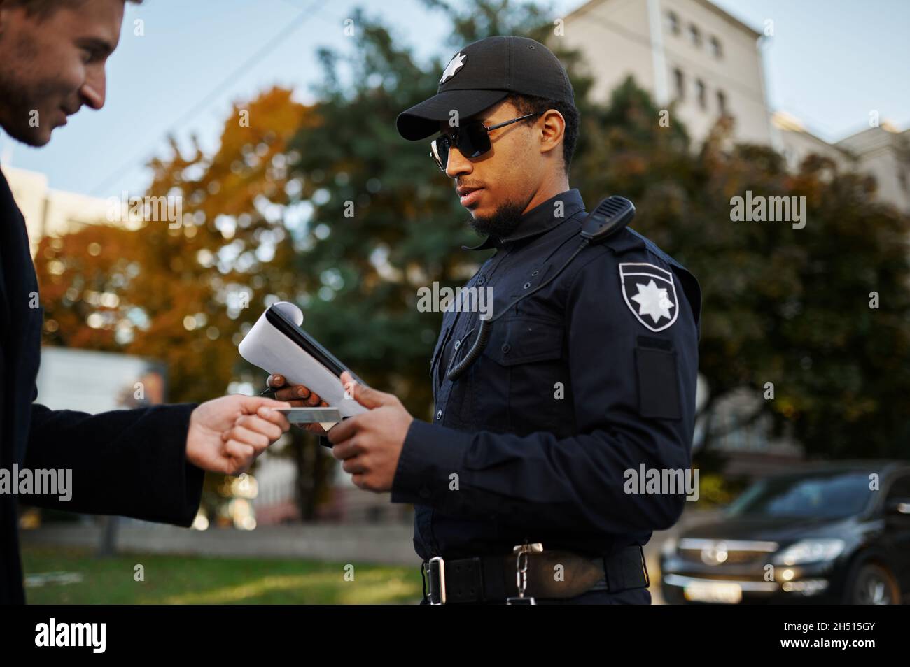Police checking the driver's license from driver Stock Photo - Alamy