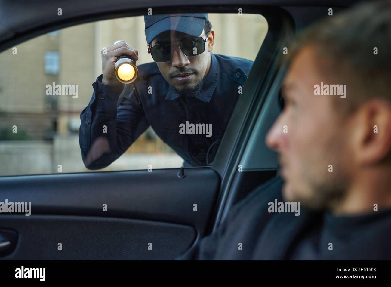 Security officer checking car hi-res stock photography and images - Alamy
