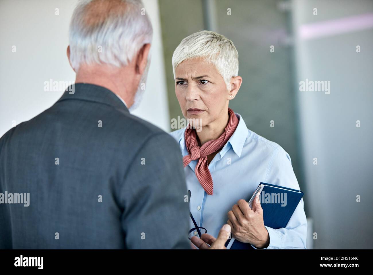 senior busniess people talking office angry argument Stock Photo - Alamy
