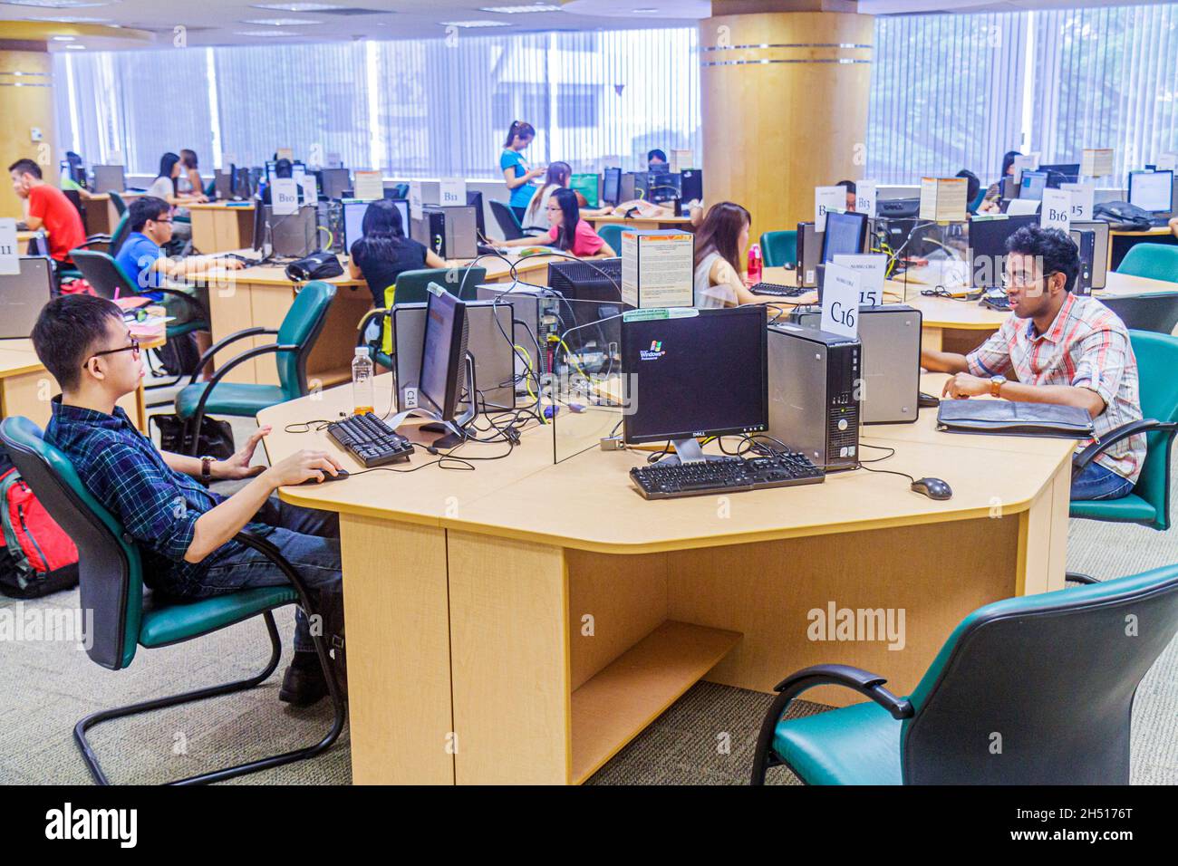 Asian male female computer stations interior inside teens teenagers hi ...