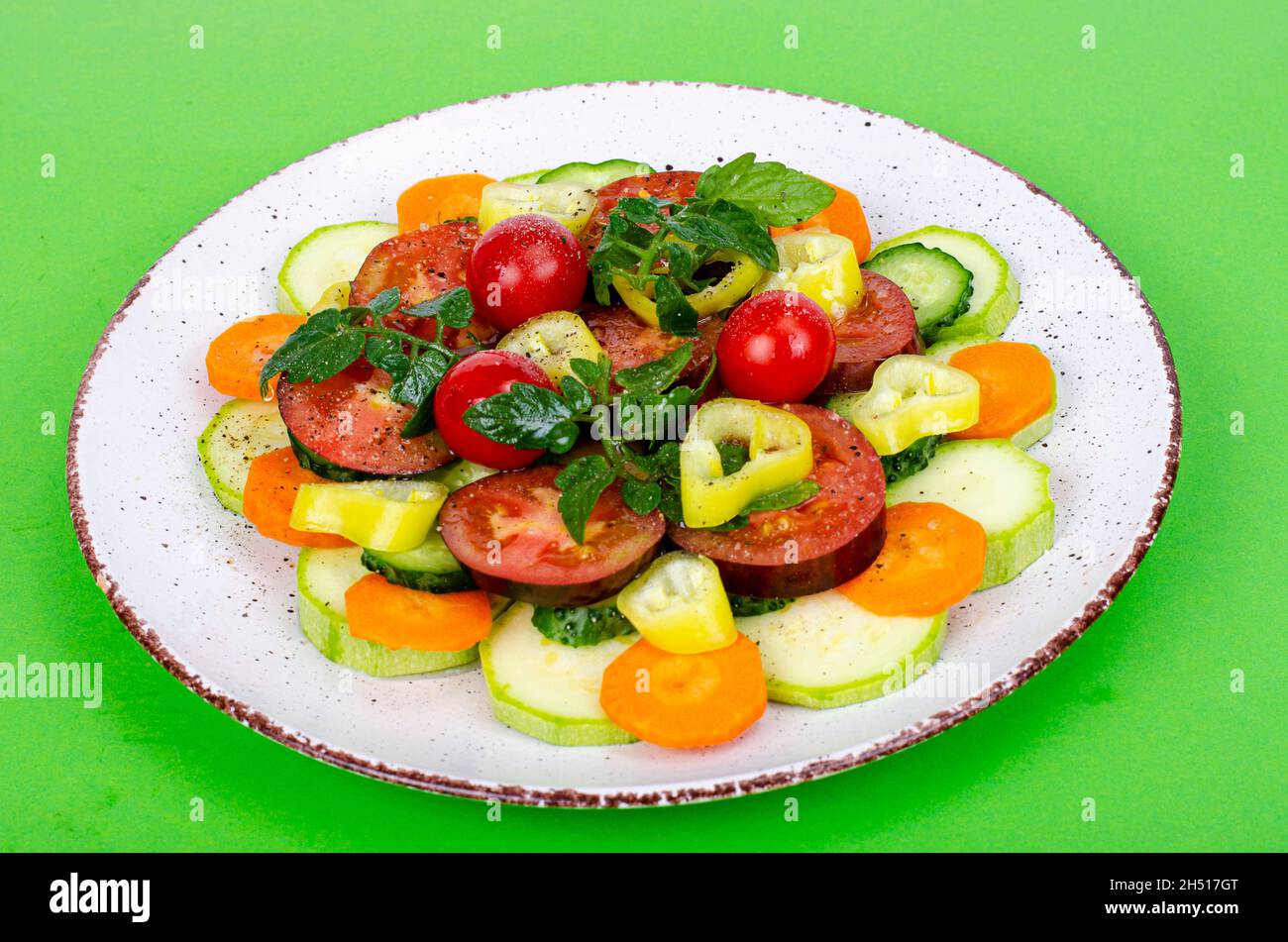 Healthy food concept. pPlate with chopped fresh vegetables on bright ...