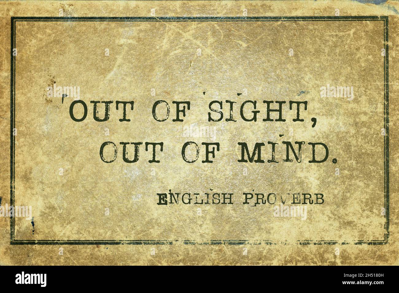 Out of sight, out of mind - ancient English proverb printed on grunge ...