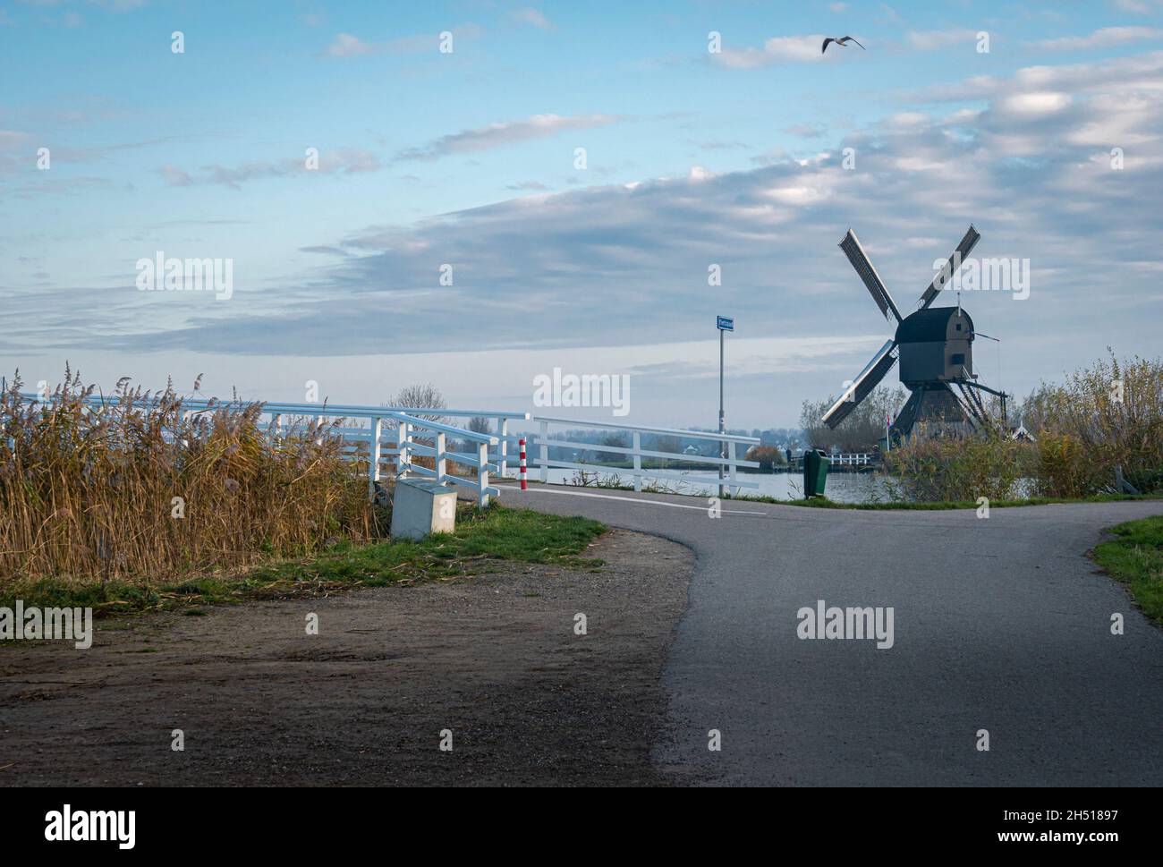 Ancient windmill and bridge at Kinderdijk, Netherlands Stock Photo - Alamy