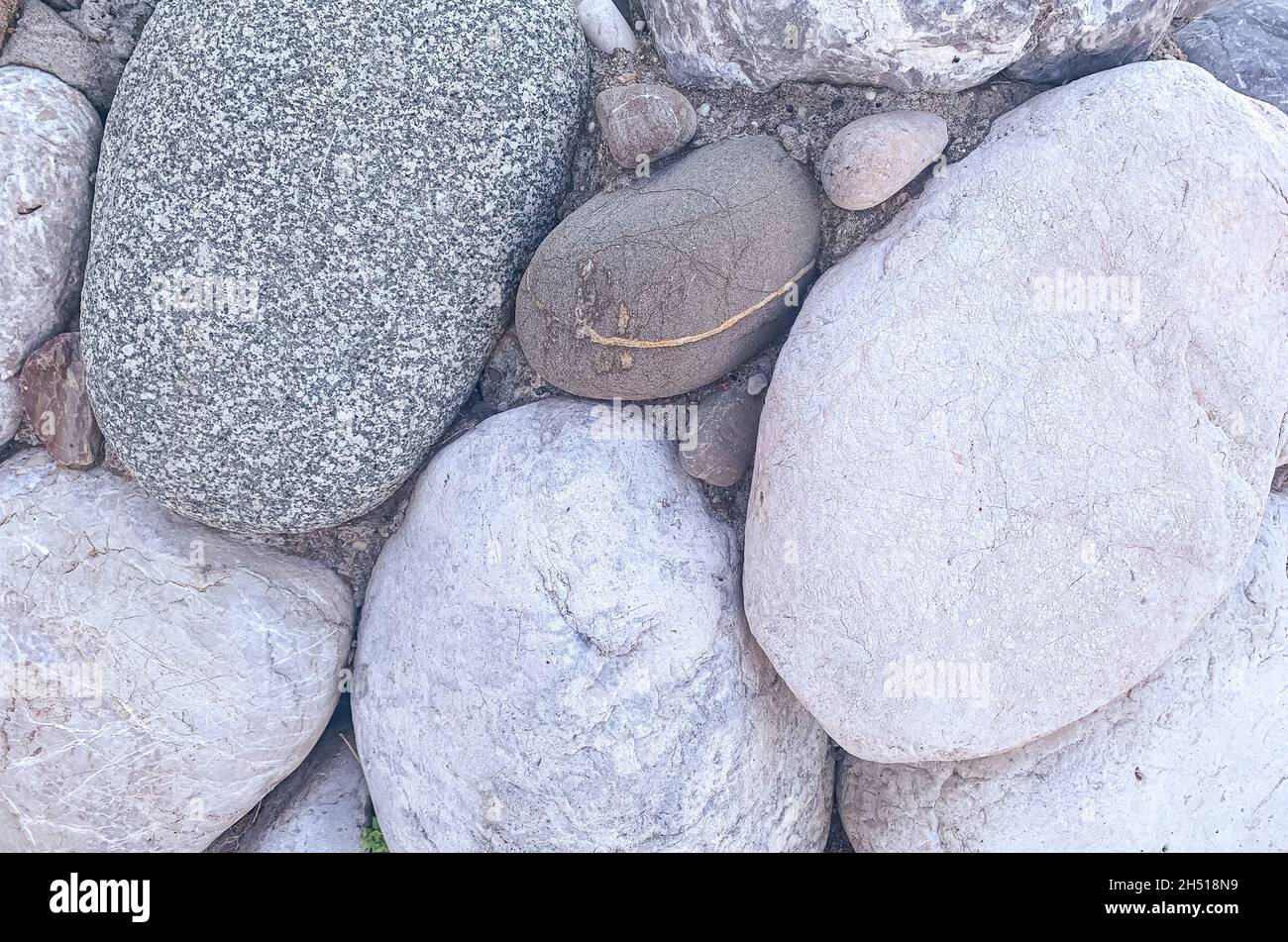 Background, texture, wall of round natural stone Stock Photo - Alamy