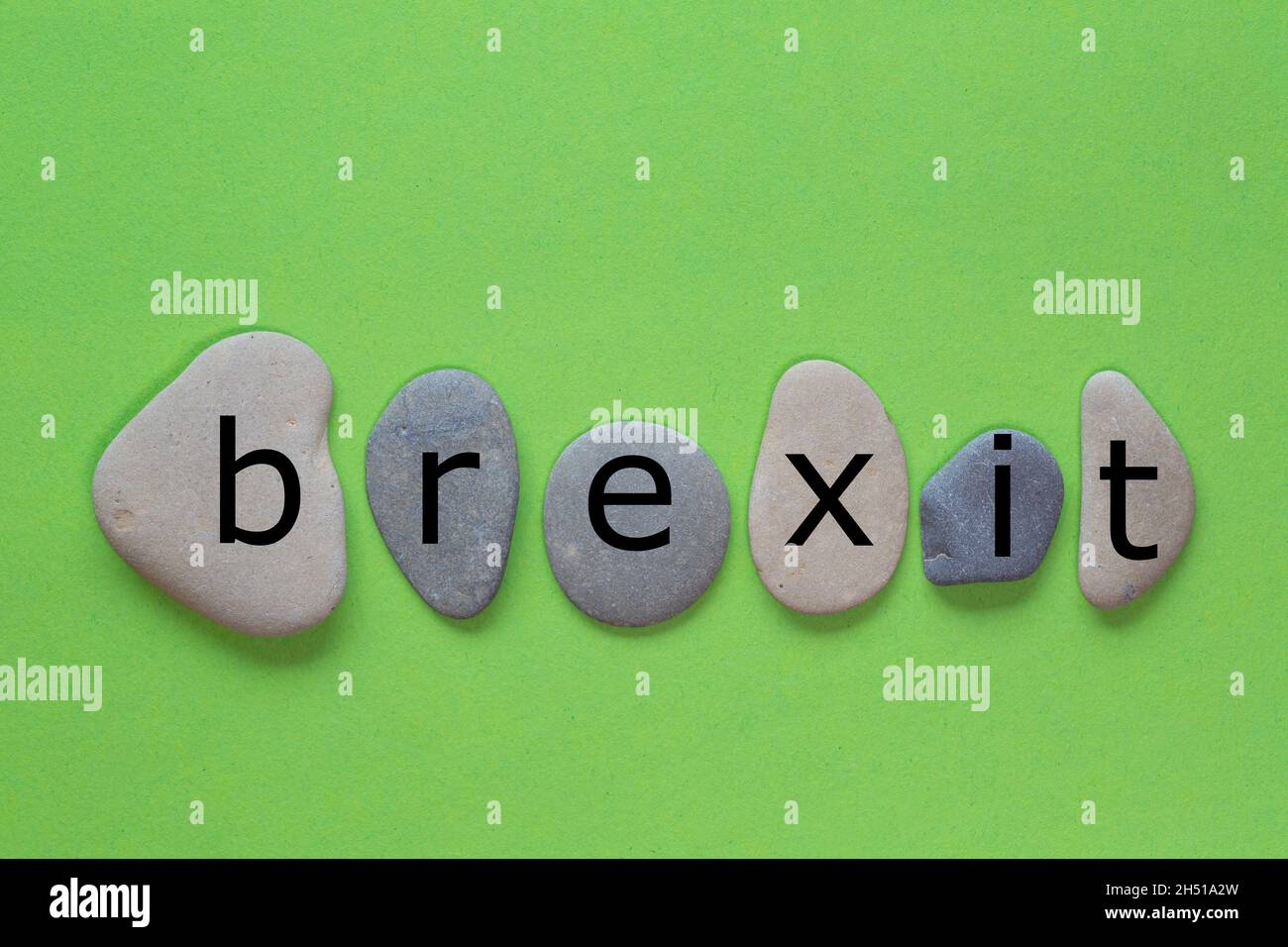 brexit as a word on flat stones in natural color. A letter in black ...