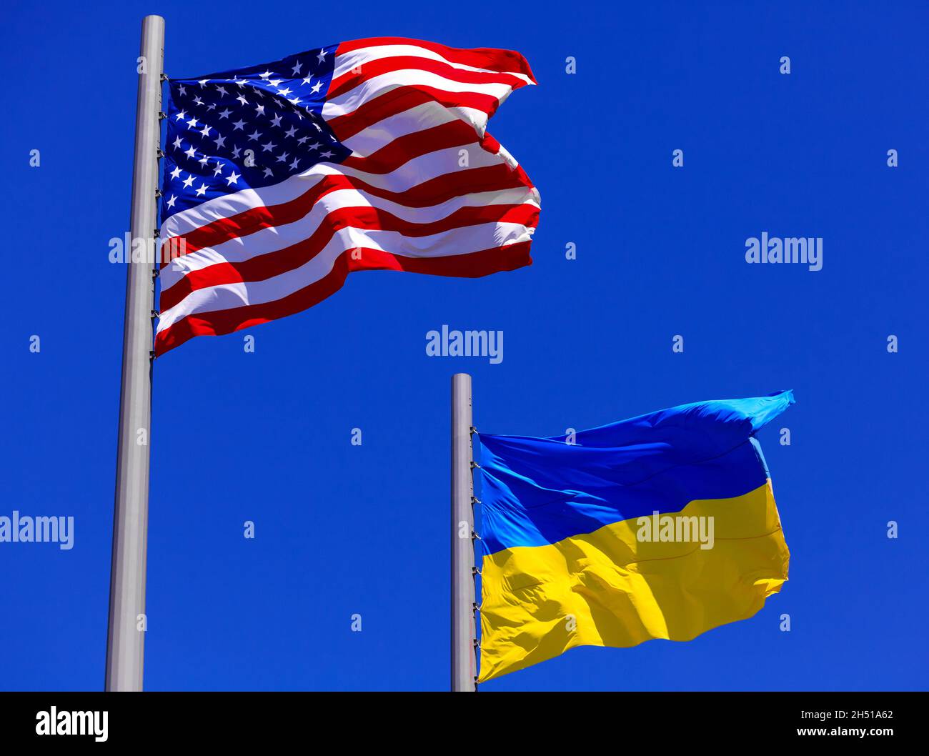 flags of the USA and Ukraine against bright blue sky Stock Photo - Alamy
